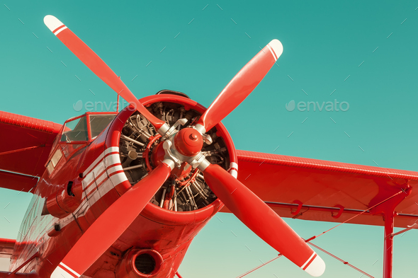 Red biplane on sky background. Close-up with engine and propeller Stock ...