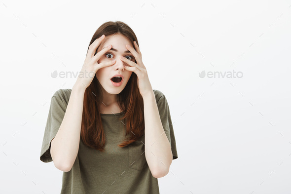 Portrait of shocked scared female seeing something frightful but ...