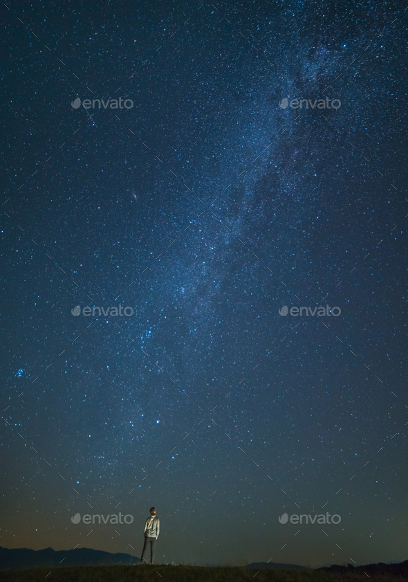 The man stand on the background of the starry sky. night time. Stock ...