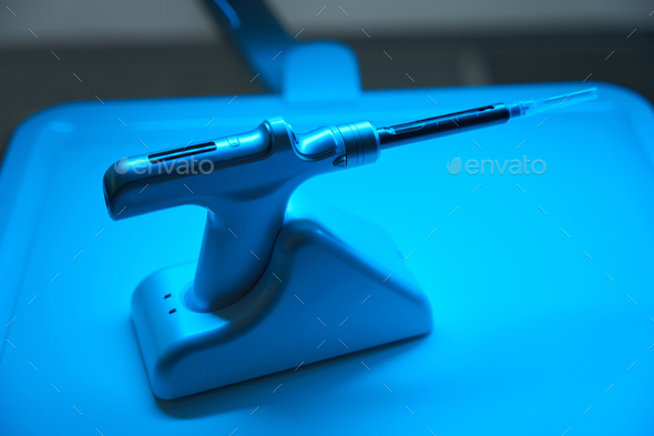 Gun for treatment and filling of root canals of teeth Stock Photo by ...