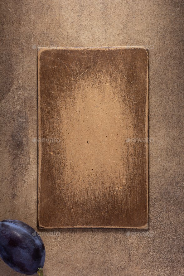 Wooden nameplate and plum at table background. Front view of name plate ...