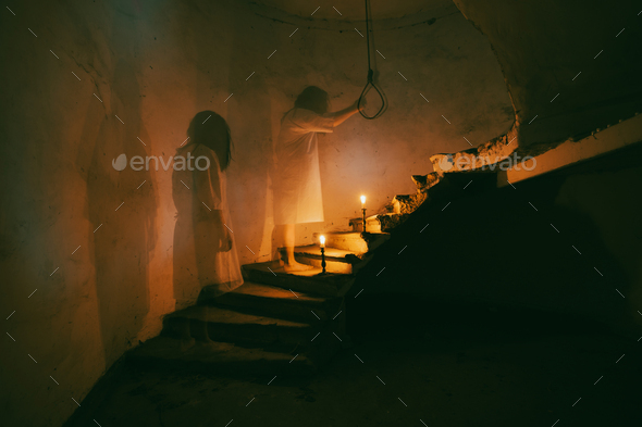 Scary ghost woman in haunted house with rope with a noose Stock Photo ...