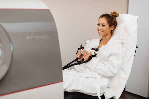 Happy woman receiving oxygen therapy at hyperbaric chamber at health ...