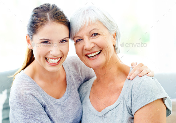 Moms still the best. An attractive young woman smiling alongside her ...
