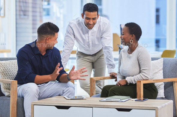 Sharing some office banter. Shot of three businesspeople having a ...