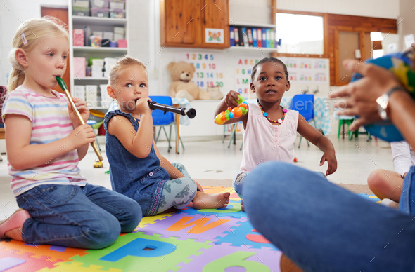 Shot of children learning about musical instruments in class Stock ...
