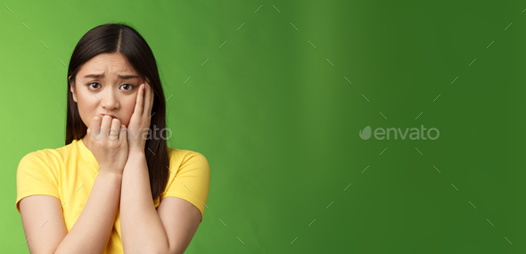 Innocent insecure timid asian scared girl panicking, standing afraid ...