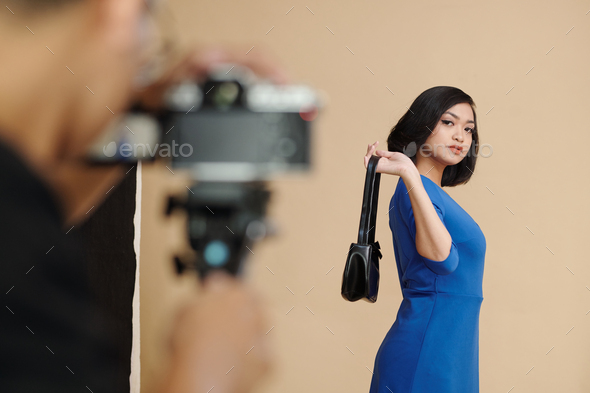 Fashion model posing at camera Stock Photo by DragonImages | PhotoDune