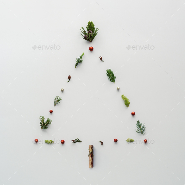 Christmas tree in the shape of a triangle on a white background ...