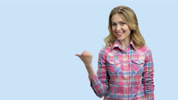 Smiling Woman Pointing Thumb Behind Her Back, Stock Footage | VideoHive