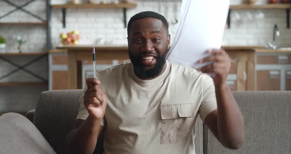 POV of African Man Making Facetime Video Calling at Home Office Waving ...