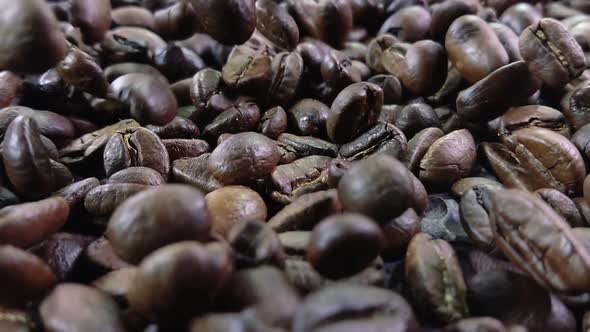 Super Closeup of Roasted Coffee Beans Bouncing and Rotating in Slow ...