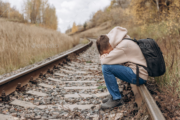 Sad Boy In Railway Track