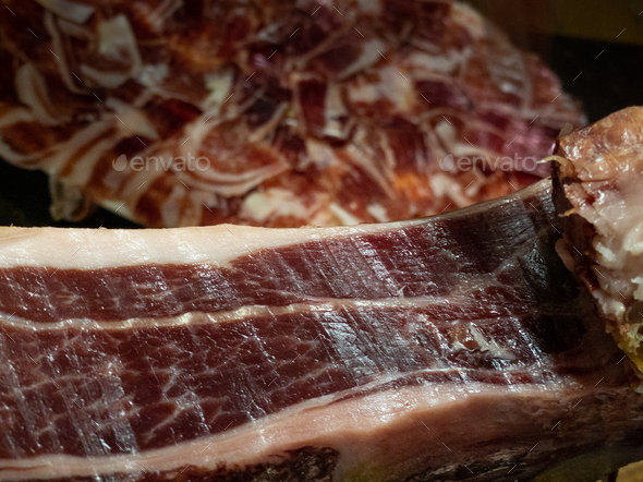 Slices spanish dried pork also known as Jamon Serrano. Typical tapa ...