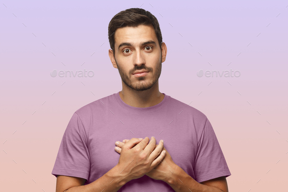 Kind hearted friendly nice guy shows kindness, wearing purple t-shirt ...