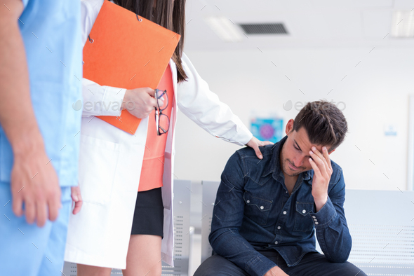 Medic giving bad diagnosis to patient Stock Photo by davidpradoperucha