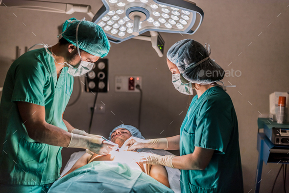 Doctors during operation in hospital operating room with patient Stock ...
