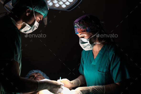 Doctors during operation in hospital operating room with patient Stock ...