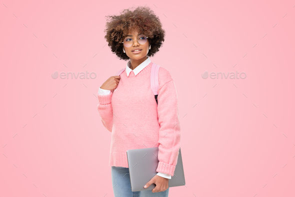 Studio portrait of smiling african teen girl, online course student ...
