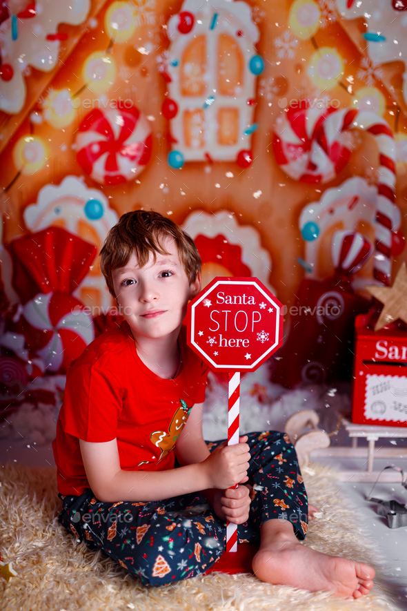 Kid reading a book at Christmas. Happy xmas and New Year, winter ...