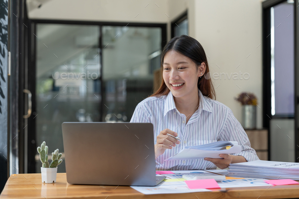 Accountant hand holding pen working on calculator to calculate business ...