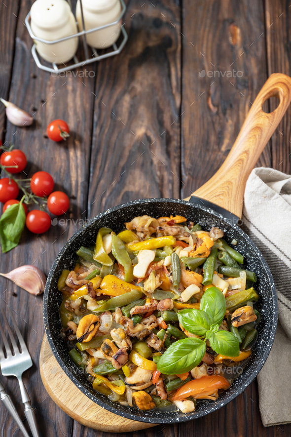 Seafood ragout, healthy mediterranean dinner. Seafood shrimps, calamari ...