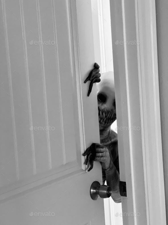 Skeleton peaking through a door. Stock Photo by marisap7 | PhotoDune