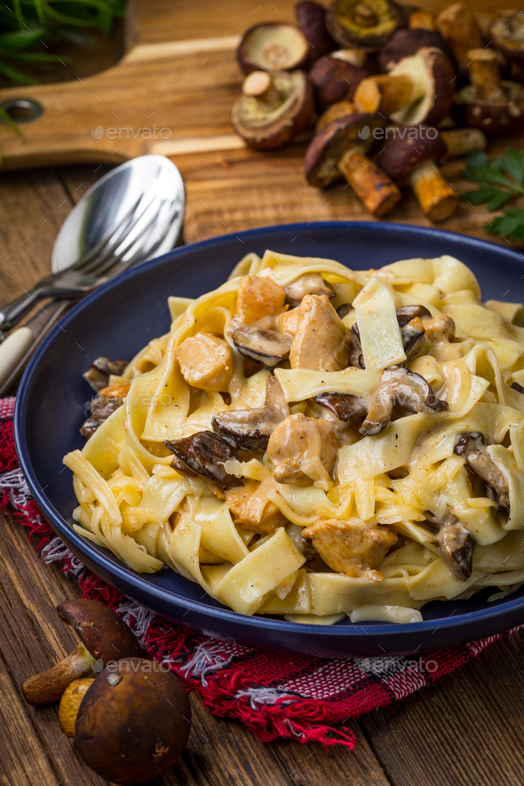 Tagliatelle pasta with forest mushrooms and chicken. Stock Photo by ...