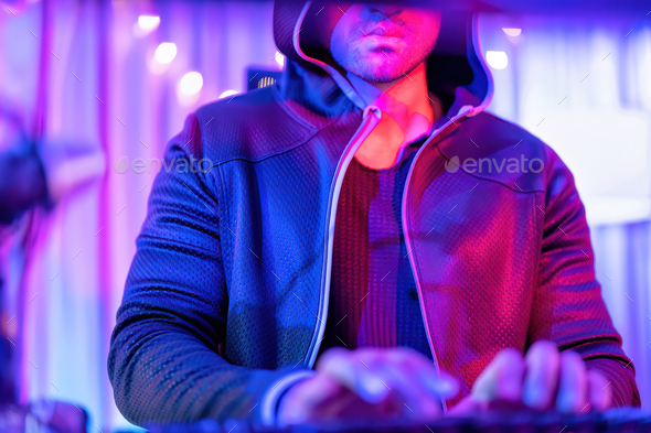 hacker wearing hood jacket typing computer keyboard to phishing steal ...