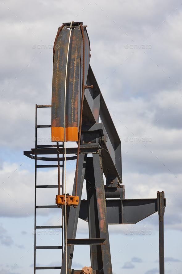 Oil pumping machine. Pump jack. Petroleum extraction. Global warming ...