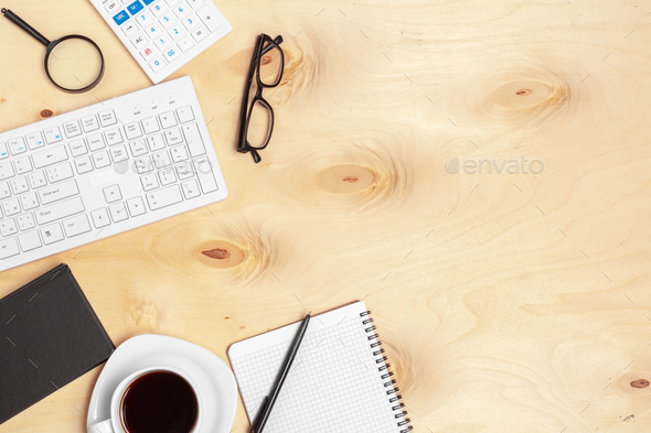 Office table with note paper, computer keyboard and supplies close up ...