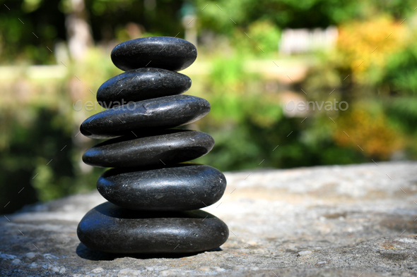 Relaxation Zen concept - stacked massage therapy stones outside ...