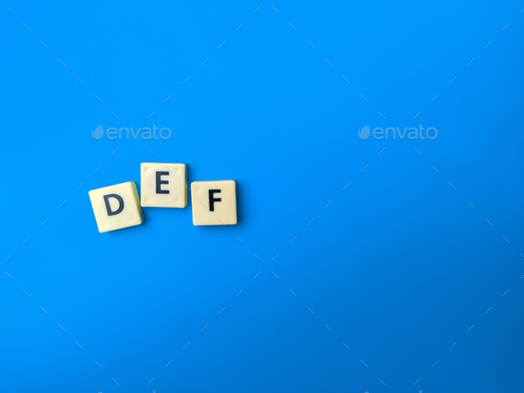 Toys word with word DEF on blue background. Education concept Stock ...