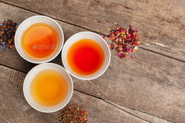 Collection of different teas in cups with tea leaves Stock Photo by ...