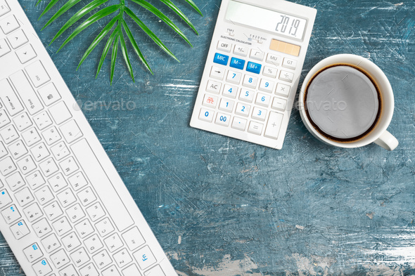 Office table with note paper, computer keyboard and supplies close up ...