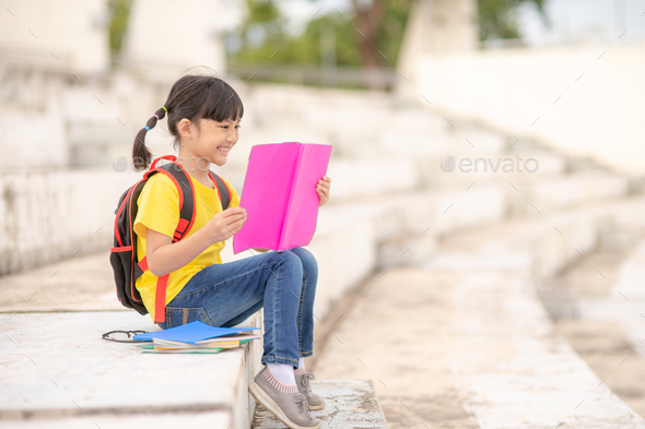 Asian young girl read a book ,Learning skills concept. Stock Photo by ...