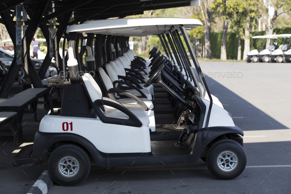 Generic club car golf carts in a parking lot Stock Photo by FamilyStock