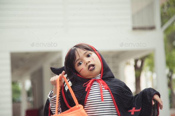 Happy Halloween! The cute little girl in Halloween costume Stock Photo ...