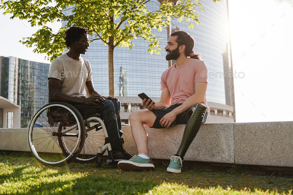 Multiracial friends with physical disability having fun outdoor Stock ...
