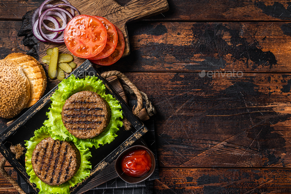 Cooking Plant based meatless burgers with vegetarian meat free roasted ...