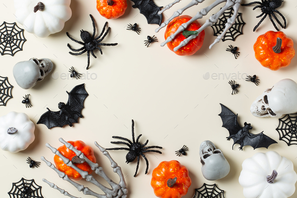 Halloween greeting card with bats, spiderweb, spider, skull and ...
