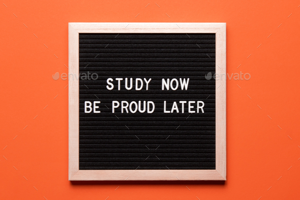 Motivational quote on black letter board on orange background. Study ...