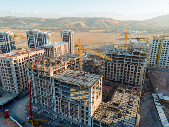 Aerial view of construction site of buildings Stock Photo by collab_media