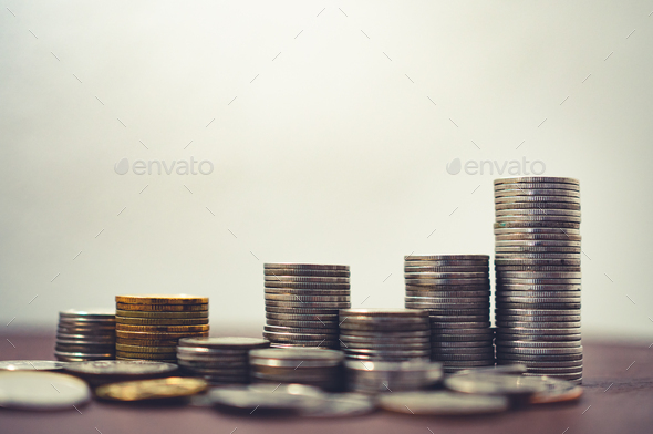 Coin stack in concept of money saving and growing business and ...