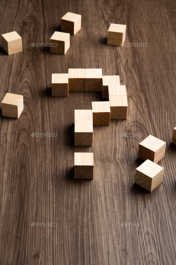 Forming bigger question mark. question mark on wooden table background ...
