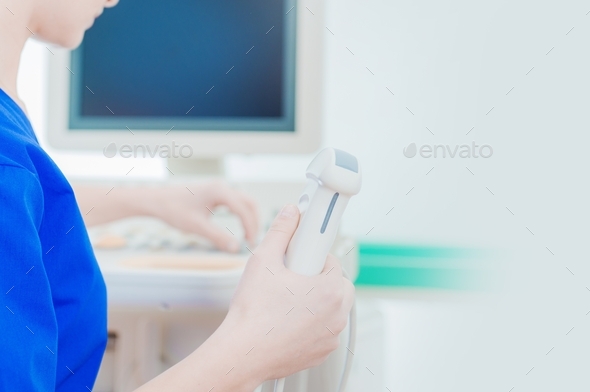 Ultrasonography Device in Hand Stock Photo by duallogic | PhotoDune