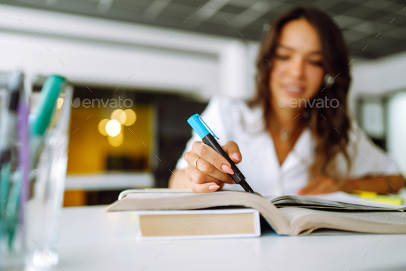 Female hand holding highlighter pen, highlighting marking important ...