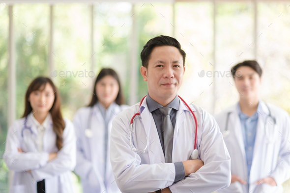 Group of Asian doctors team portrait standing with colleagues in ...
