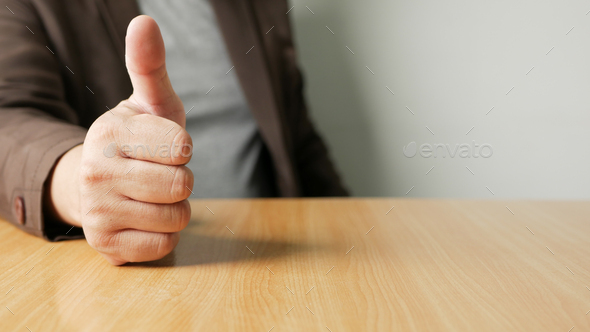 Business man showing thumb up sign gesture to congratulate your success ...