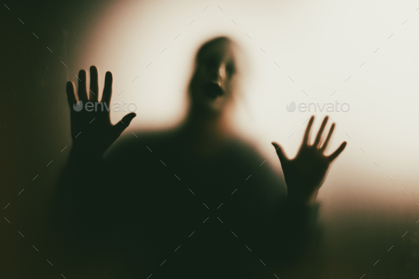 Shadowy figure behind glass - horror background Stock Photo by erika8213